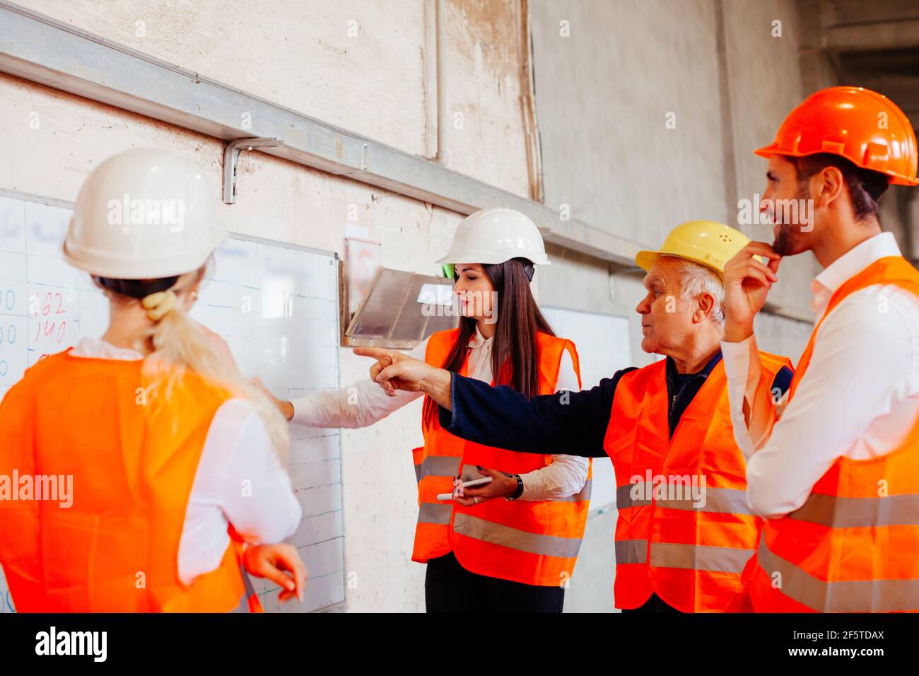 The young engineers are practicing at the factory Stock Photo - Alamy