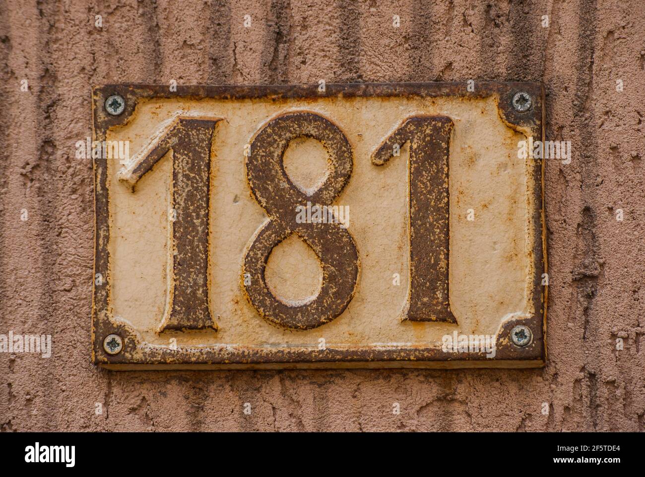 Old retro weathered cast iron plate with number 181 closeup Stock Photo ...