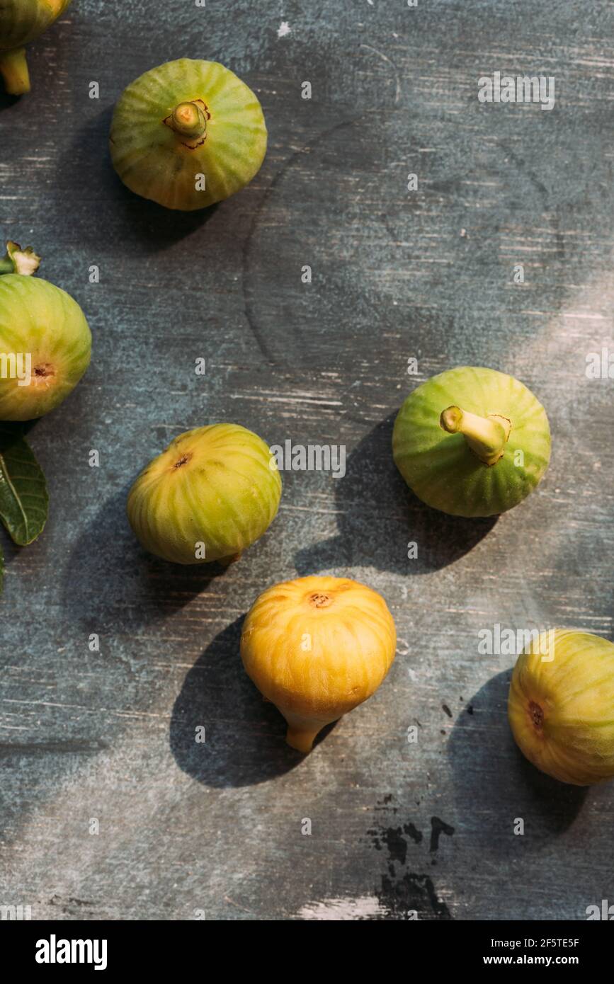 Ripe sweet green figs, freshly harvested from domestic tree, on table ...