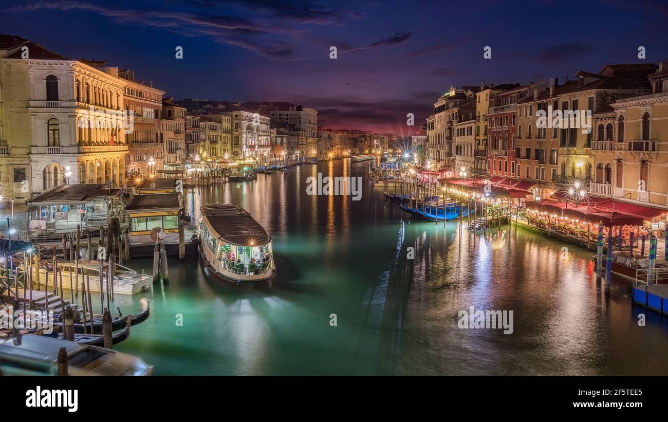 Scenic view of Grand Canal between old residential buildings under ...