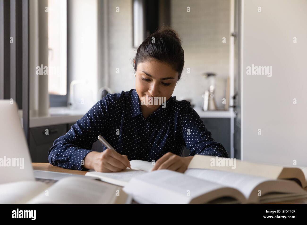 Indian girl writing hi-res stock photography and images - Alamy