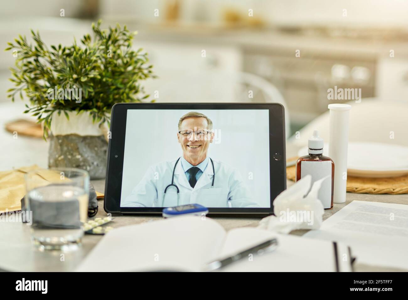 Making a video-call with medical doctor with help of tablet Stock Photo ...