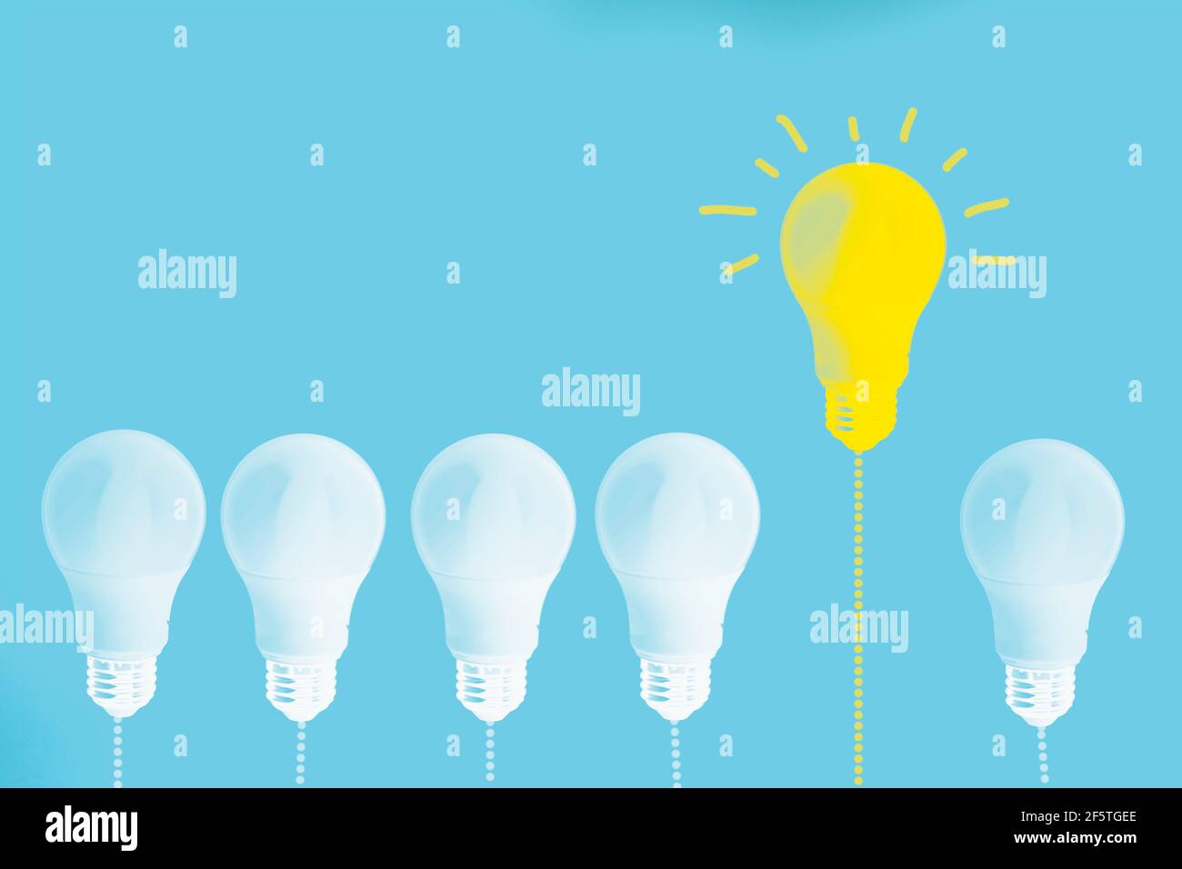 Yellow light bulb on blue background. Creative idea, new idea and ...