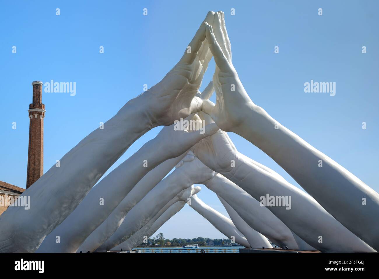 Big white hands of Building Bridges sculpture by Lorenzo Quinn in the ...