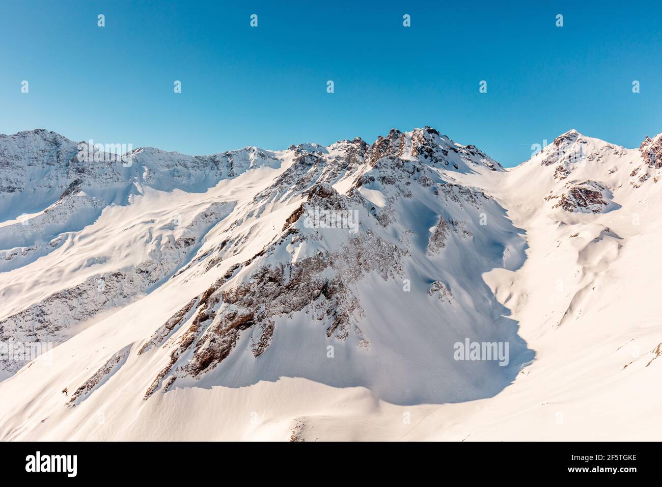 Wonderful view of the snow-capped Swiss Alps and blue sky from the ...