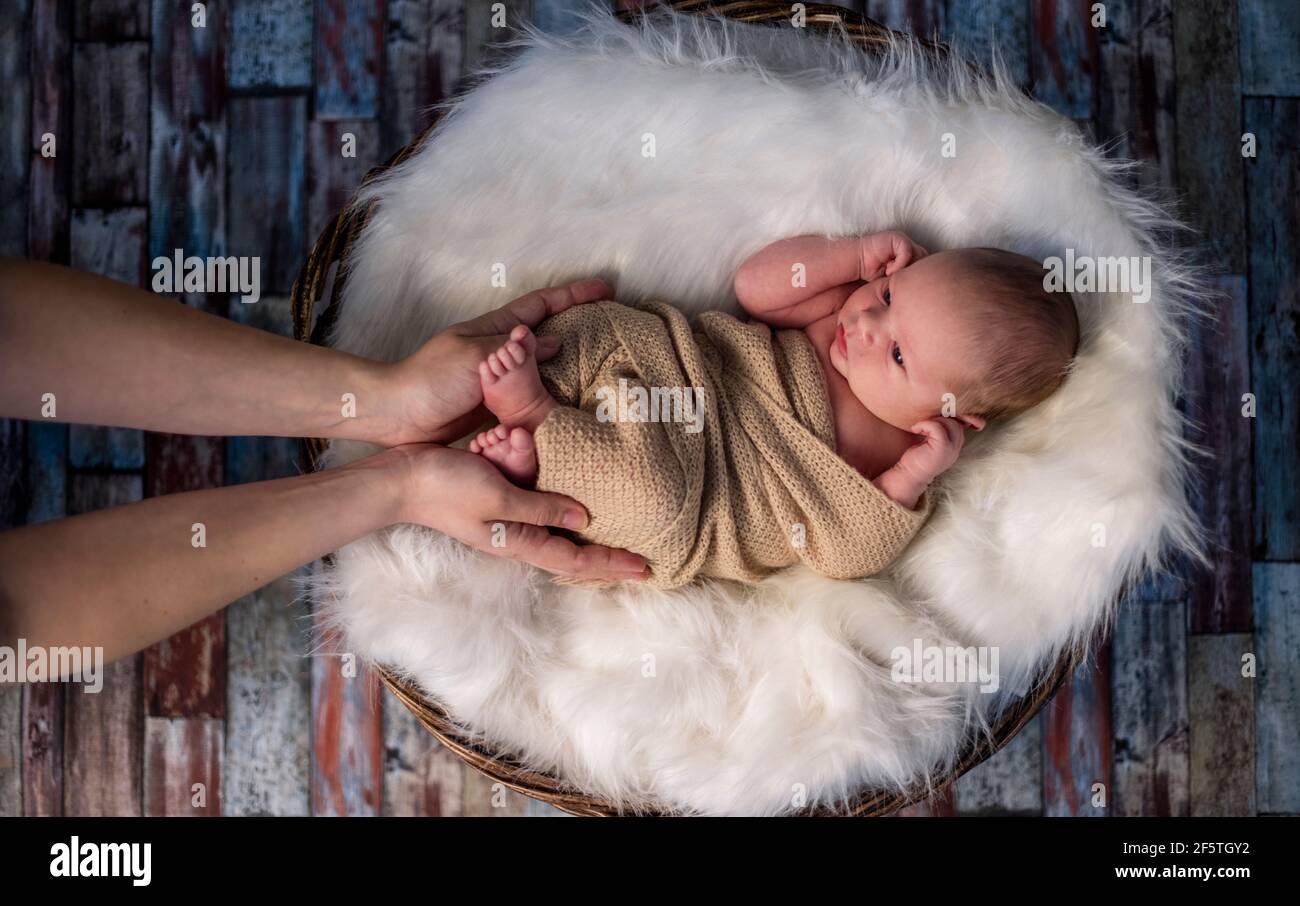 Hands mother touching newborn baby hi-res stock photography and images ...