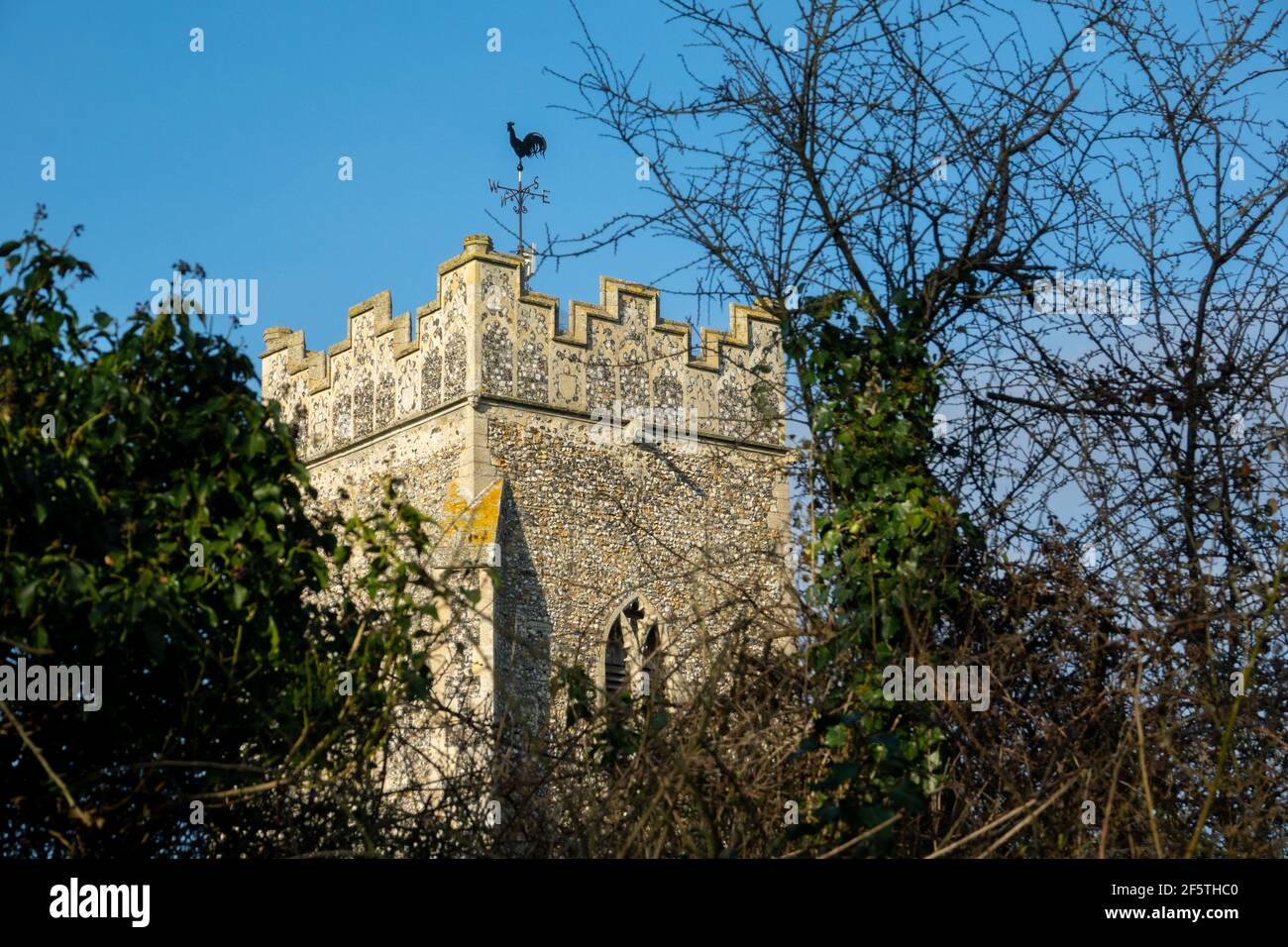 Ringland church tower with weather cock Stock Photo - Alamy
