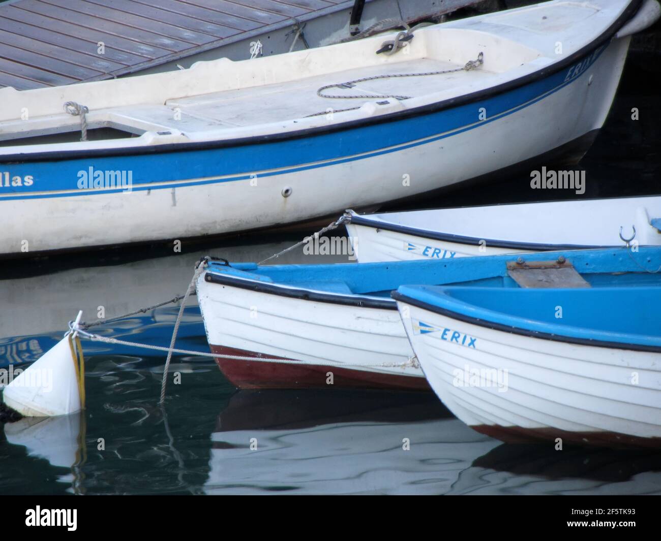 small blue and white boats Stock Photo - Alamy