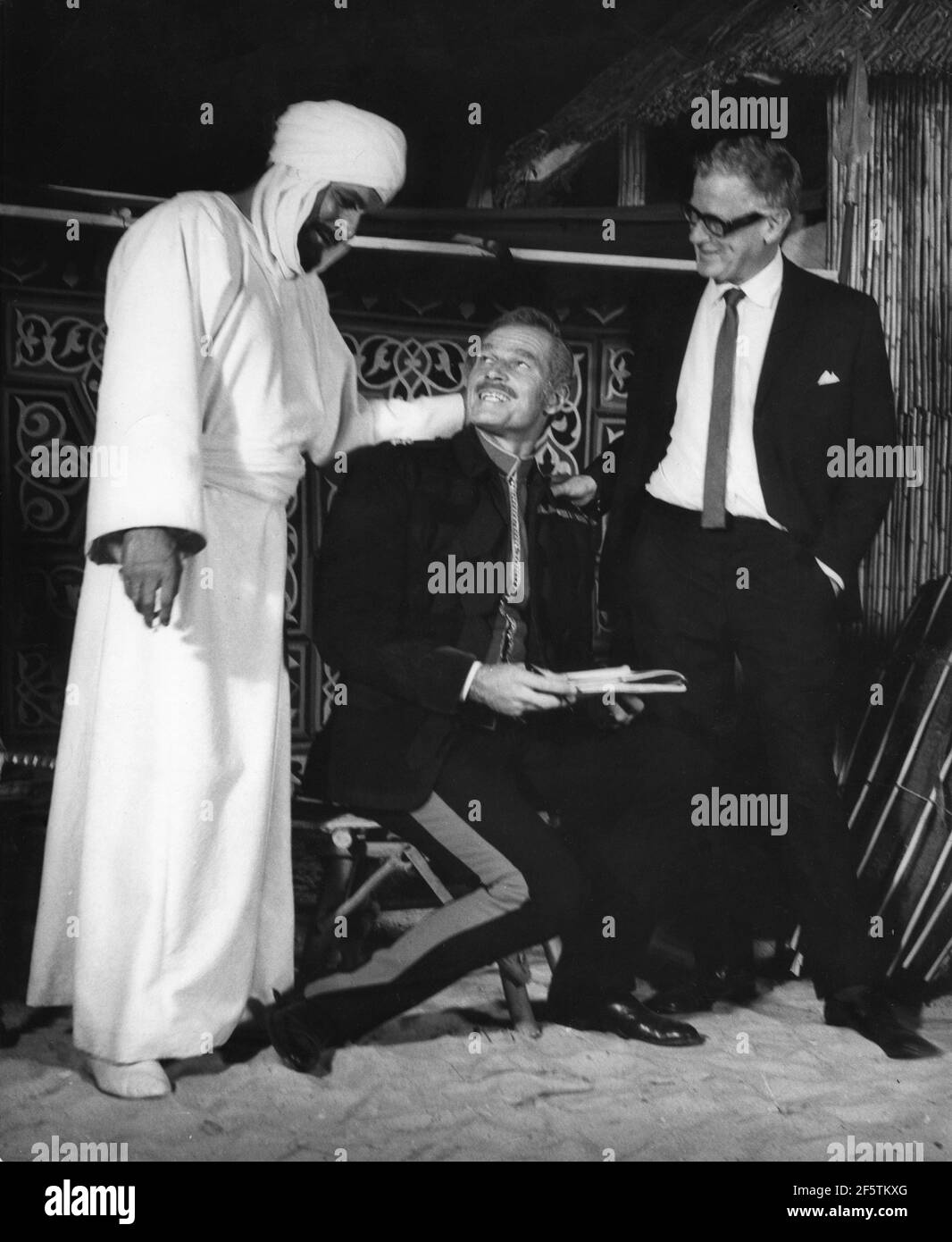 LAURENCE OLIVIER in costume as The Mahdi CHARLTON HESTON as General ...