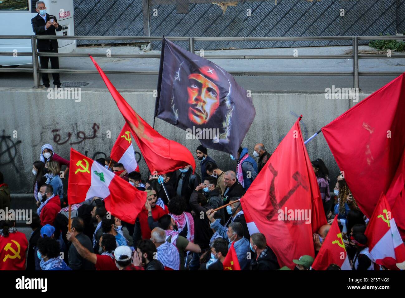 Beirut, Lebanon. 28th Mar, 2021. A man takes pictures of members of the ...