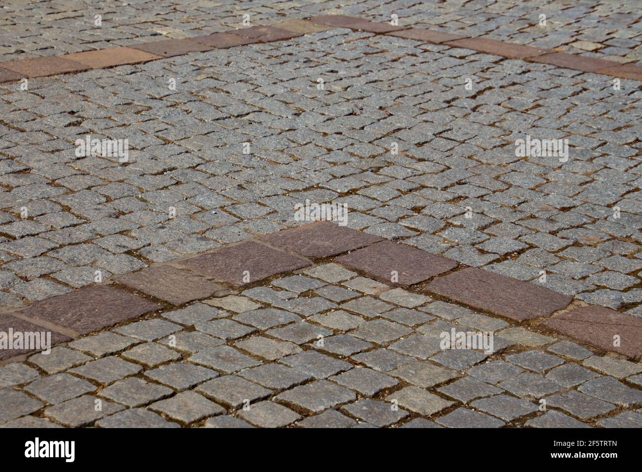 Close up of geometric cobblestone texture with colored cobblestones ...