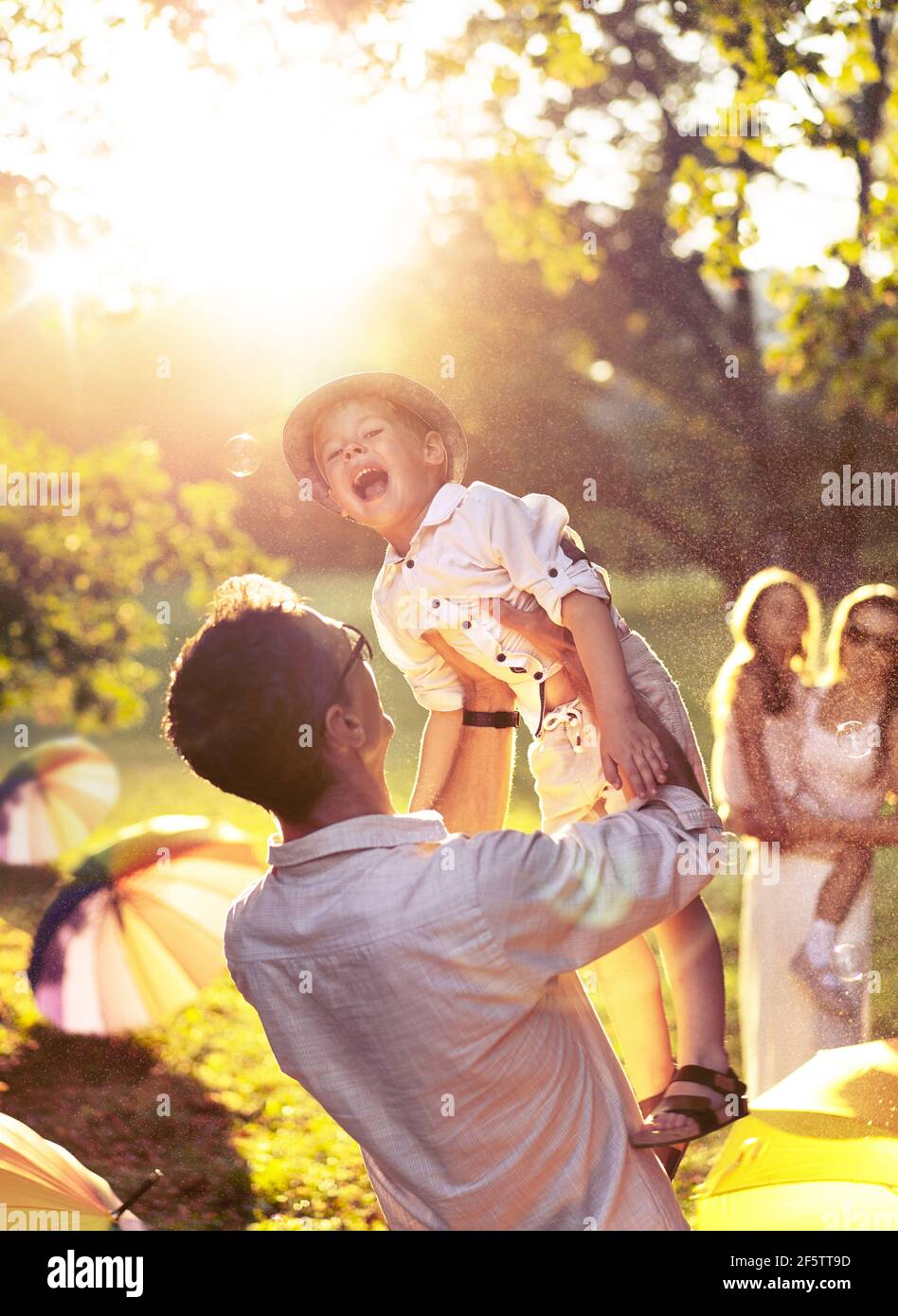 Child carrying umbrella hi-res stock photography and images - Alamy