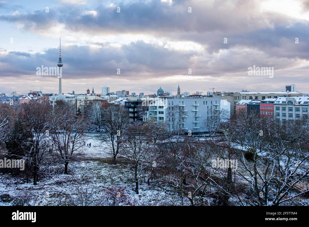 Berlin Skyline with TV tower & snow covered trees In Weinberg Park ...