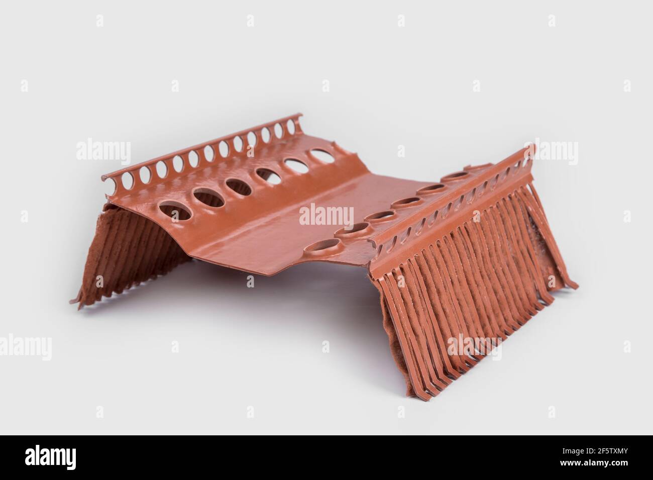 Tiles ridge roof ventilation on a white background Stock Photo - Alamy