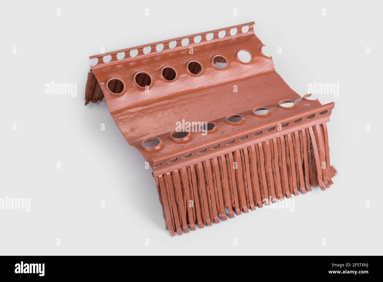 Tiles ridge roof ventilation on a white background Stock Photo - Alamy