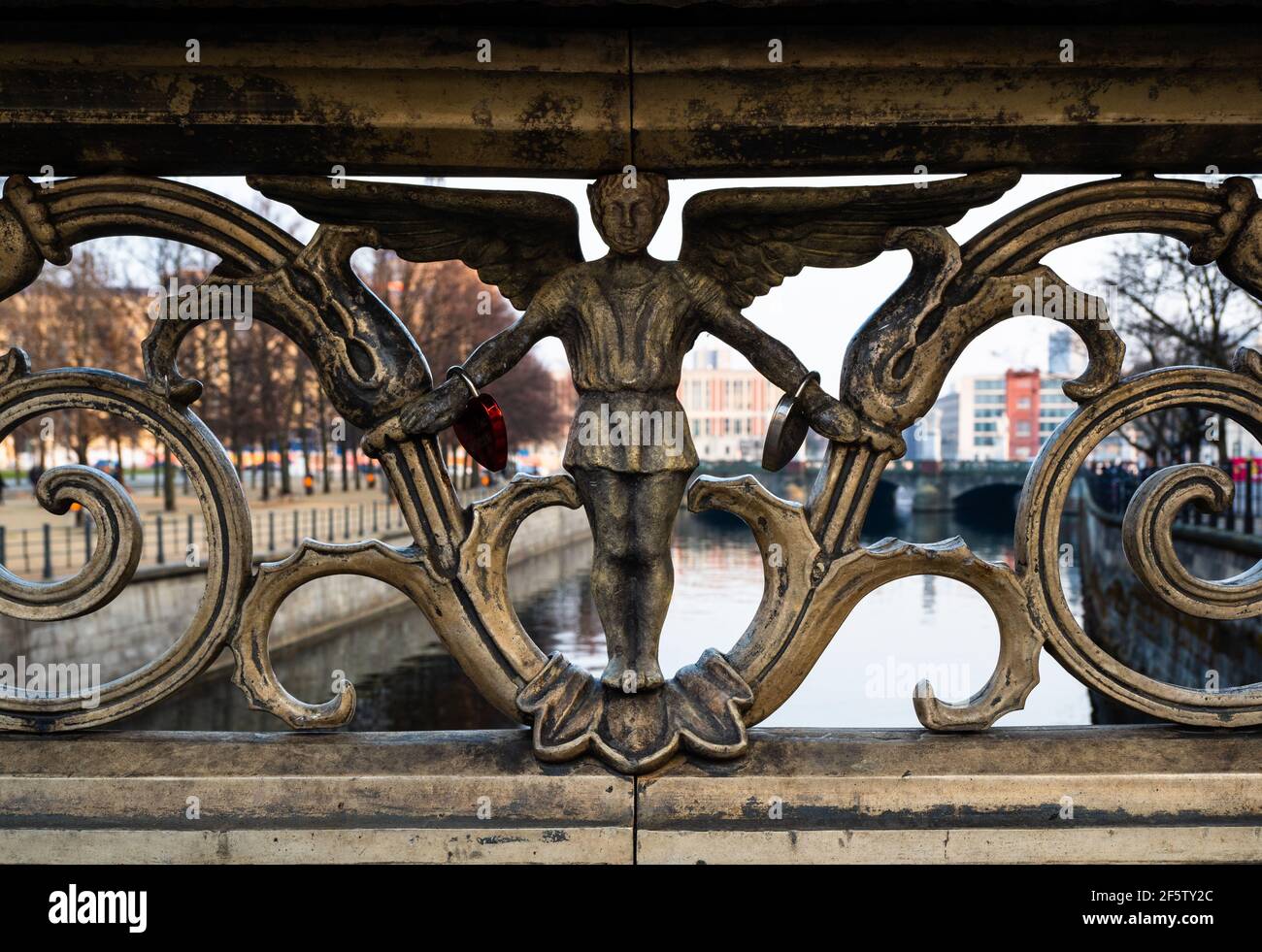 Cute padlocks on the parapet detail male hands on the Berlin Eiserne ...