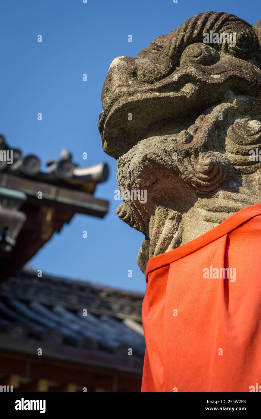 A komainu lion-dog statue guarding the entrance to Himuro Jinja shinto ...
