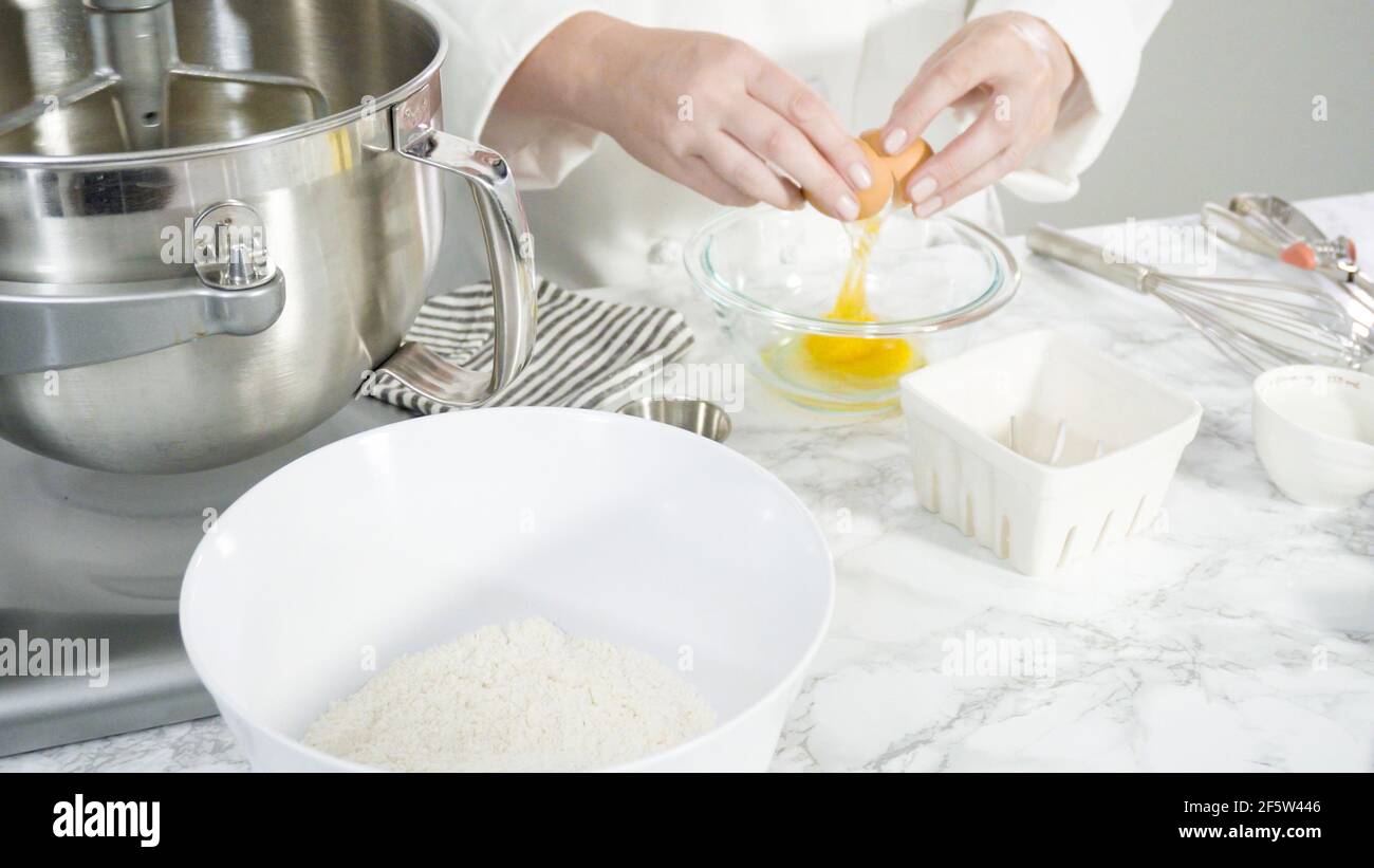 Step by step. Mixing ingredients in kitchen mixer to bake mermaid theme ...