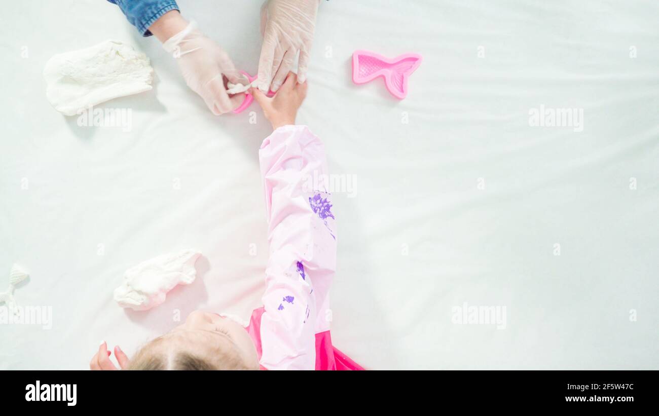 Flat lay. Step by step. Making mermaid tail from modeling clay in ...