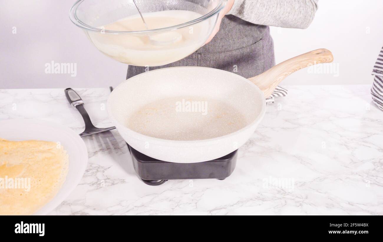 Making crepes in a small frying pan over medium heat Stock Photo - Alamy