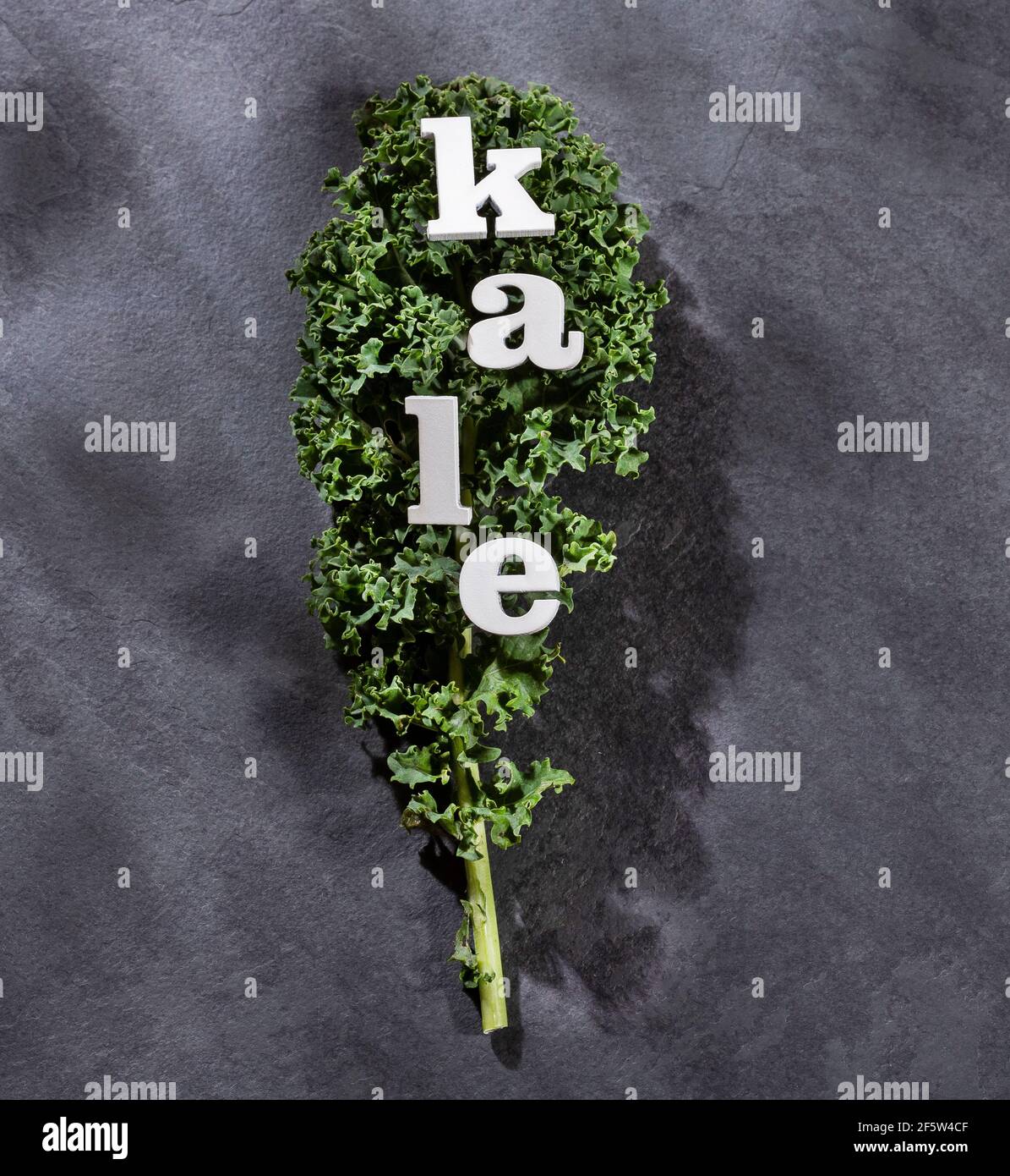 Word kale in letters with organic leaves - Brassica oleracea var ...