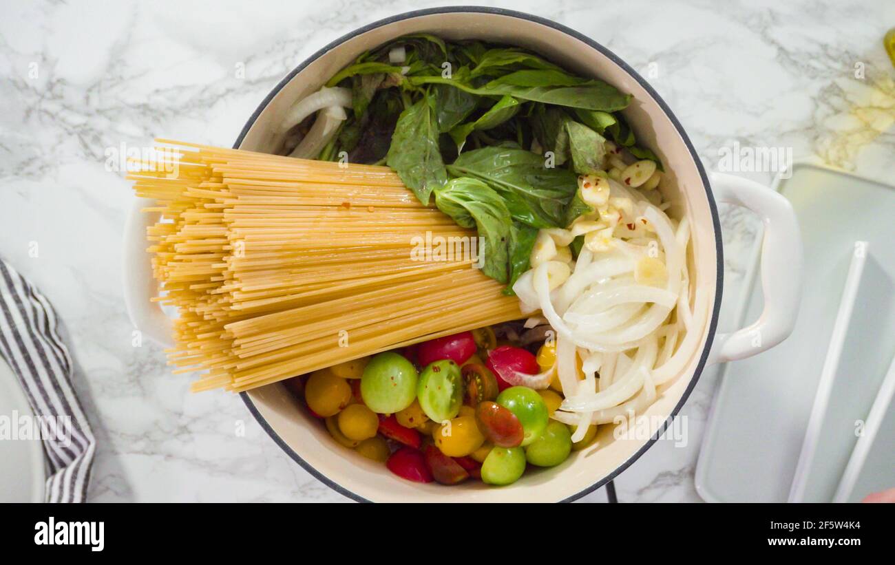 Flat lay. Step by step. Cooking on pot pasta recipe in an enameled cast ...