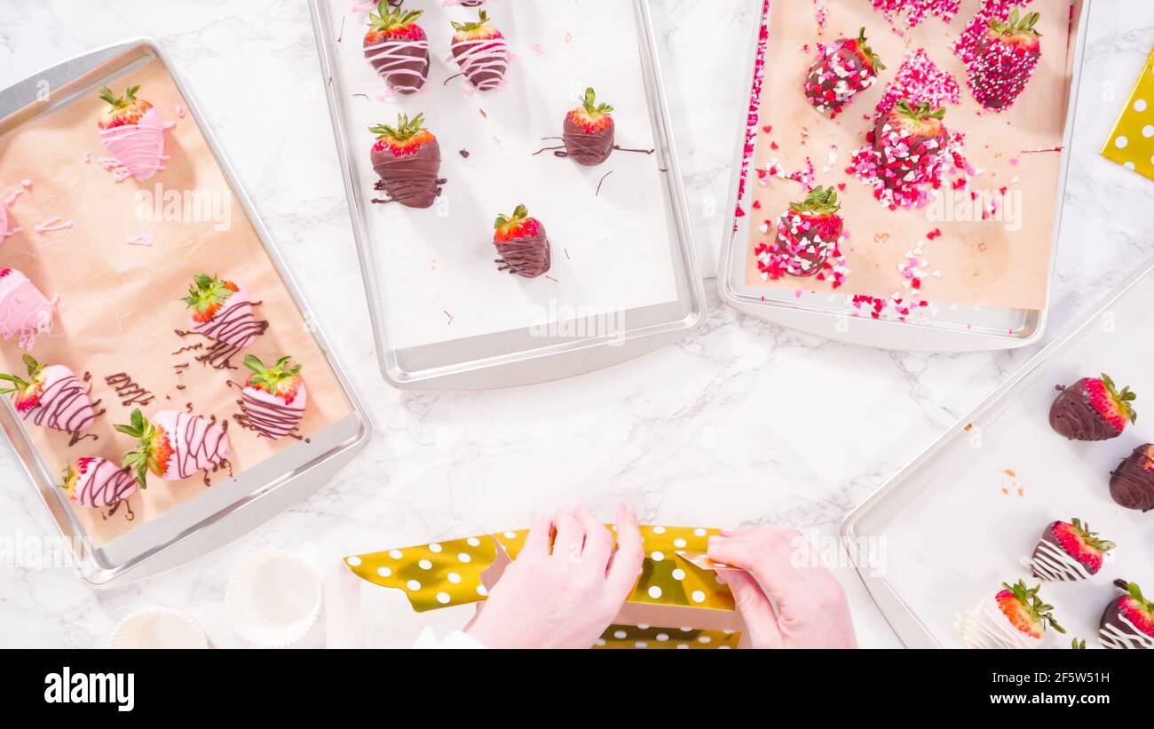 Flat lay. Step by step. Packing gourmet chocolate dipped strawberries ...