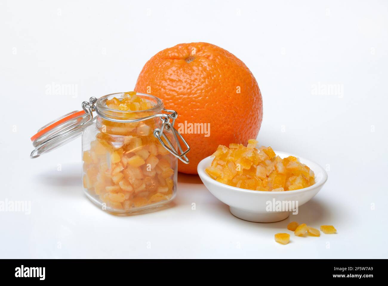 Candied orange peel cubes in glass and peel, Germany Stock Photo - Alamy