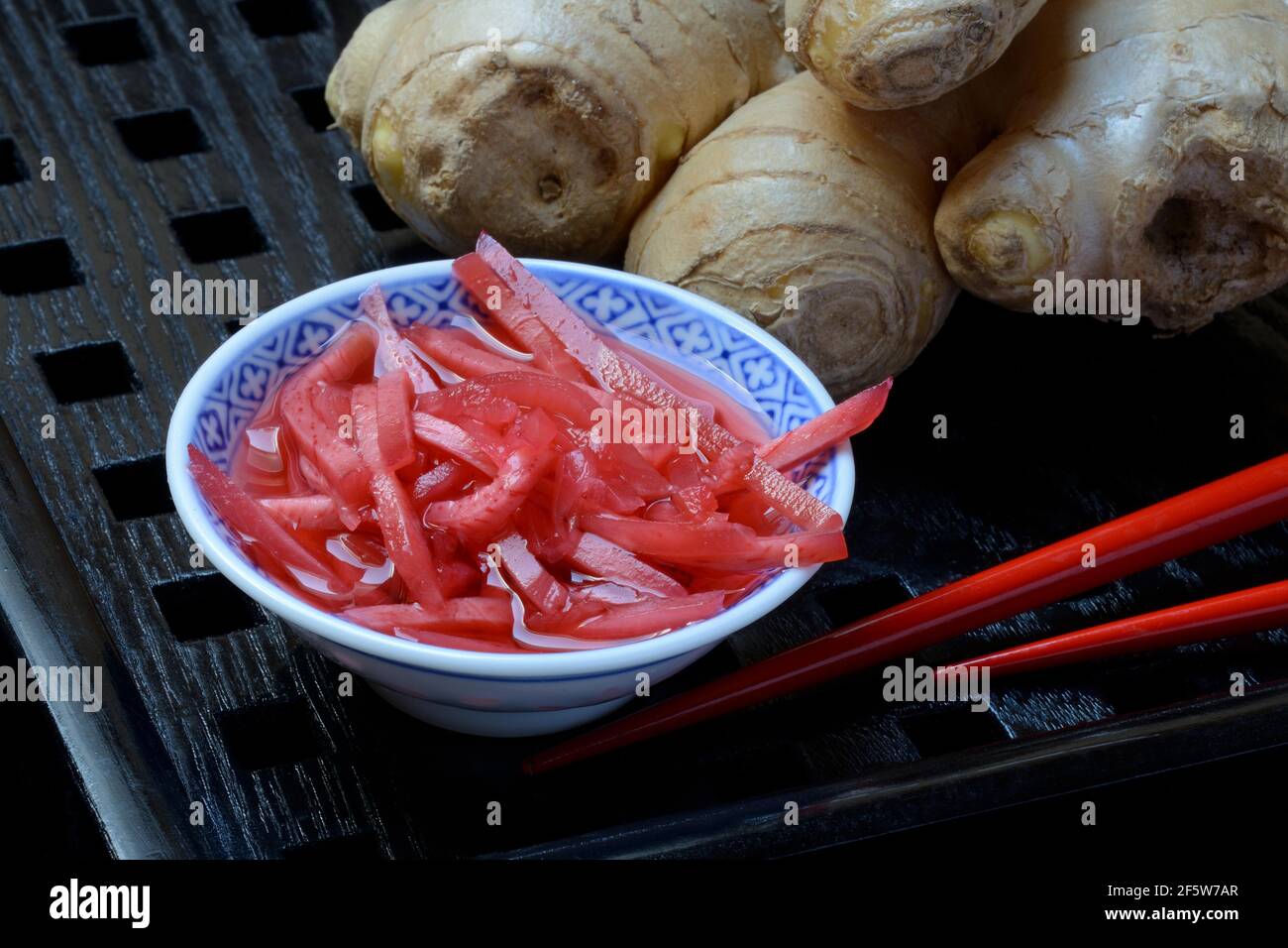 Pickled ginger in small bowls and ginger root, Germany Stock Photo - Alamy