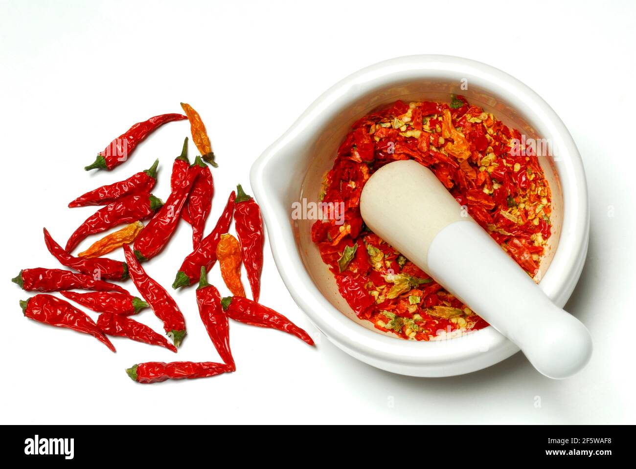 Dried chilli peppers in grating bowl, cayenne, paprika, chilli pepper ...