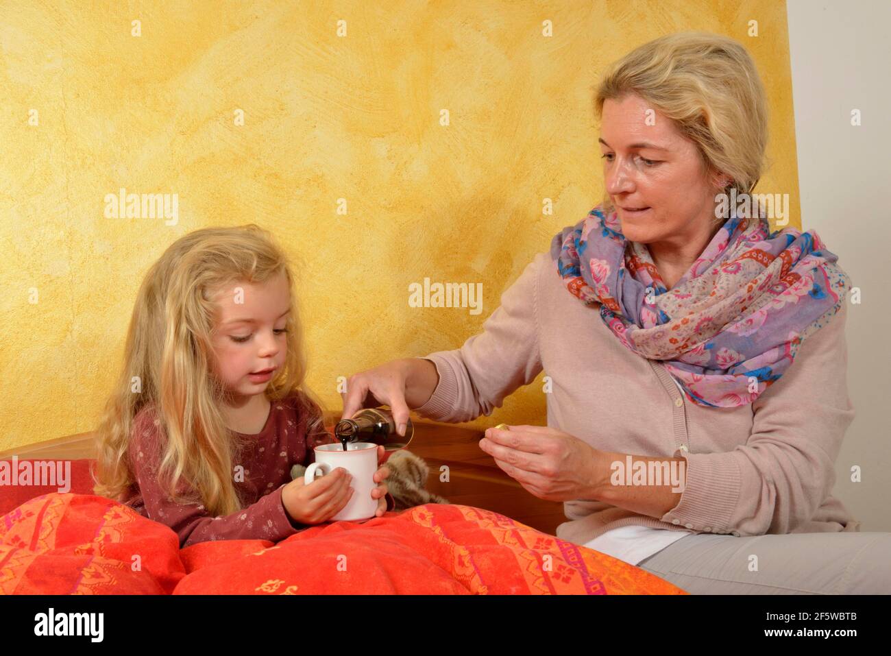 Girl drinking elderberry juice (Sambucus nigra) (Sambuci fructus Stock ...