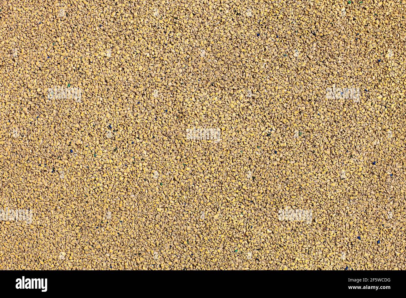 The golden rubber playground surface as background Stock Photo - Alamy