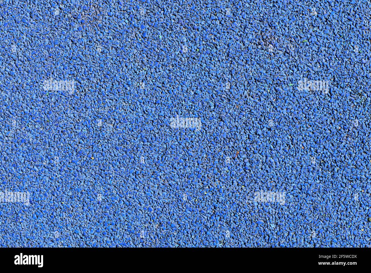 The blue rubber playground surface as background Stock Photo - Alamy
