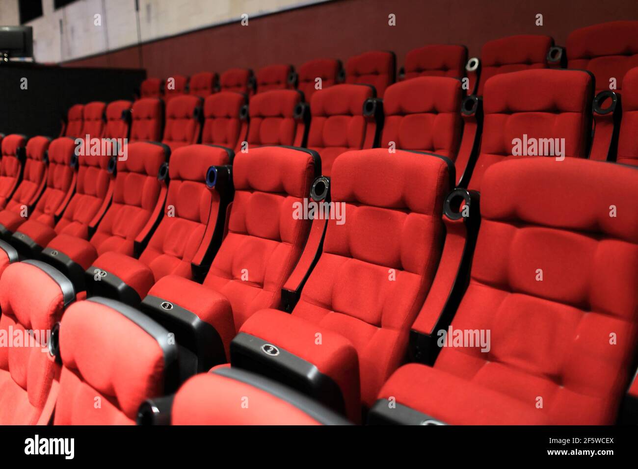 Red soft seats in the empty theatre Stock Photo - Alamy