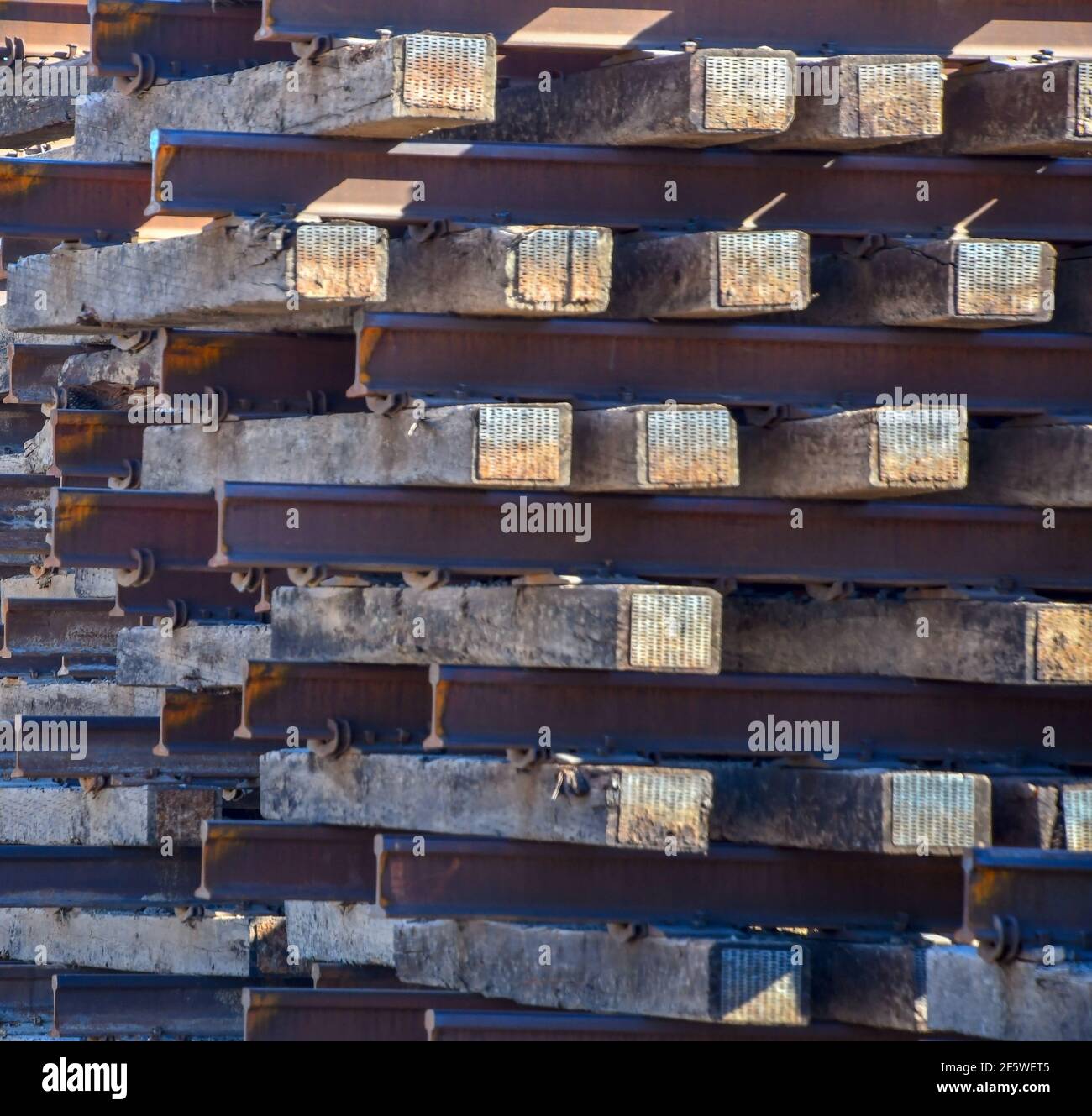 Rows of railroad ties stacked and supported by steel rails in El Paso ...