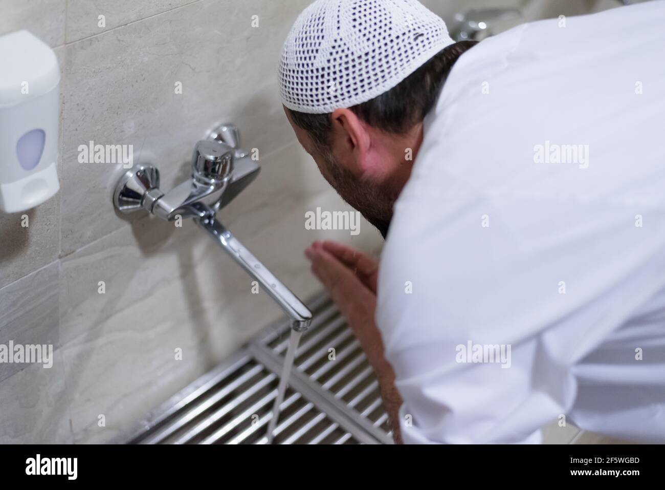 Muslim man taking ablution for prayer. Islamic Religious Rite Ceremony ...