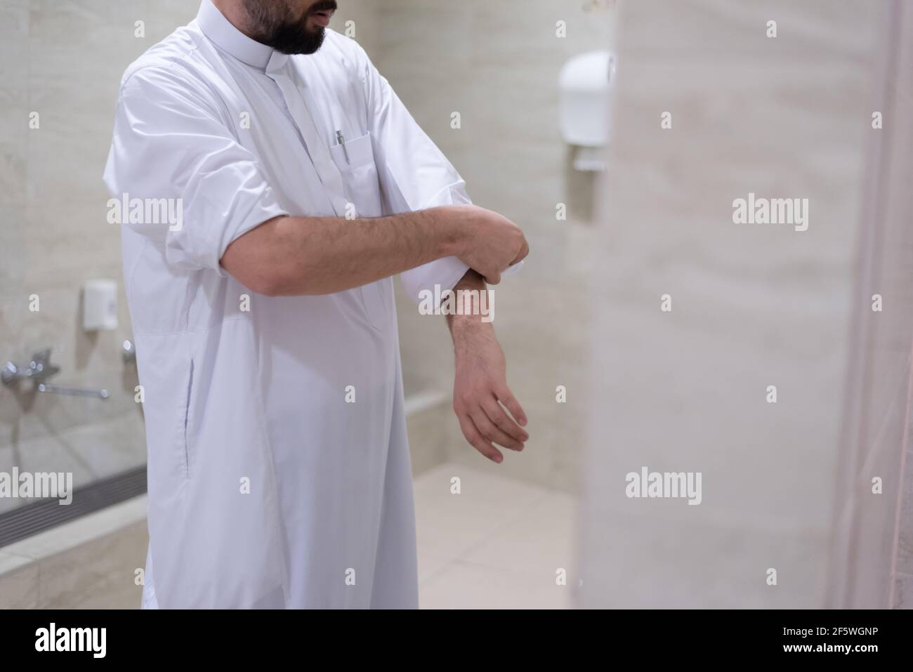 Muslim man taking ablution for prayer. Islamic Religious Rite Ceremony ...