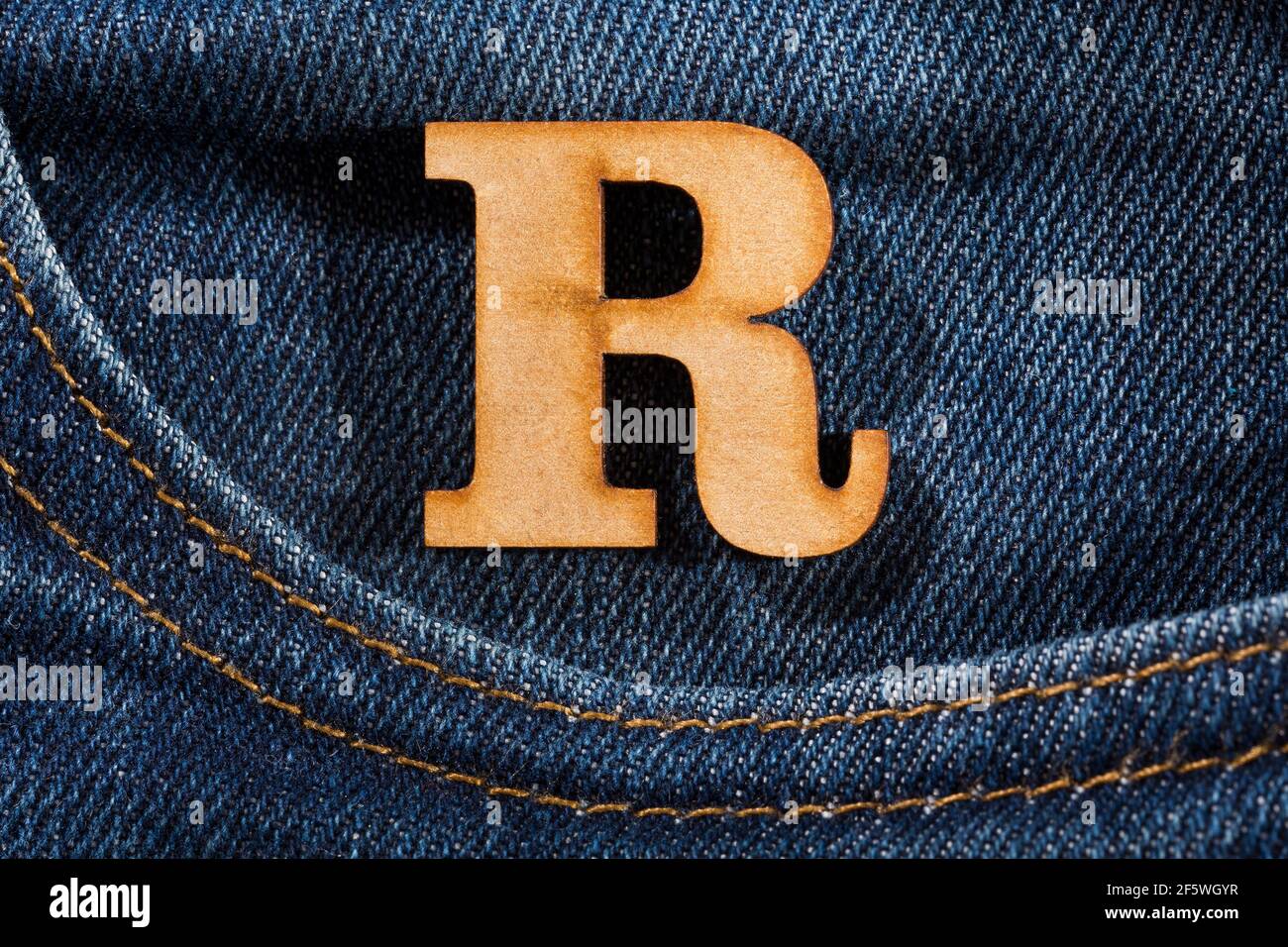 Letter R of the alphabet - blue jeans texture background Stock Photo ...