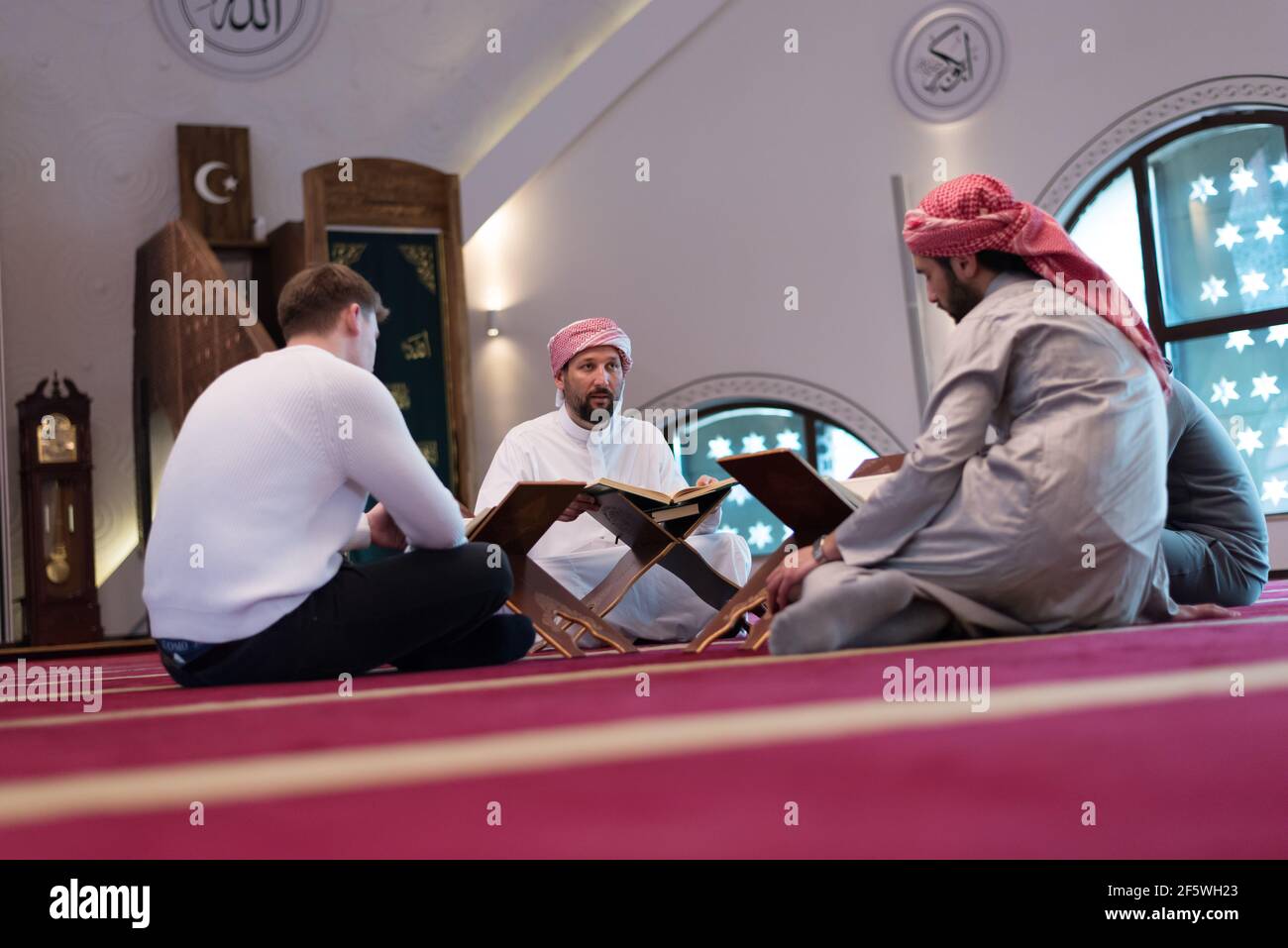 Group of Muslims reading, reciting and remembering Quran during the ...