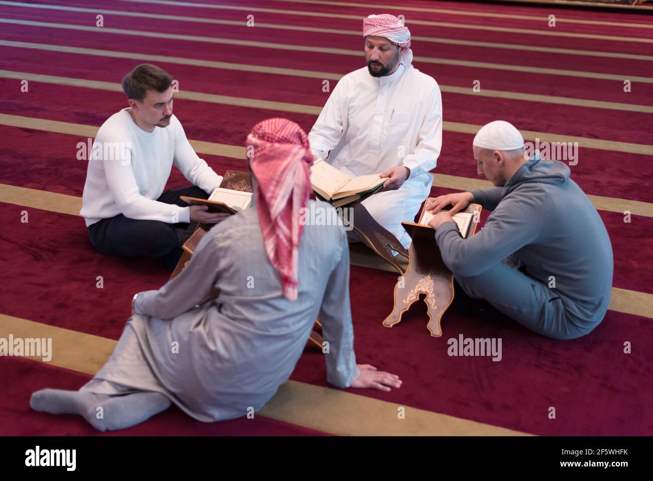 Group of Muslims reading, reciting and remembering Quran during the ...