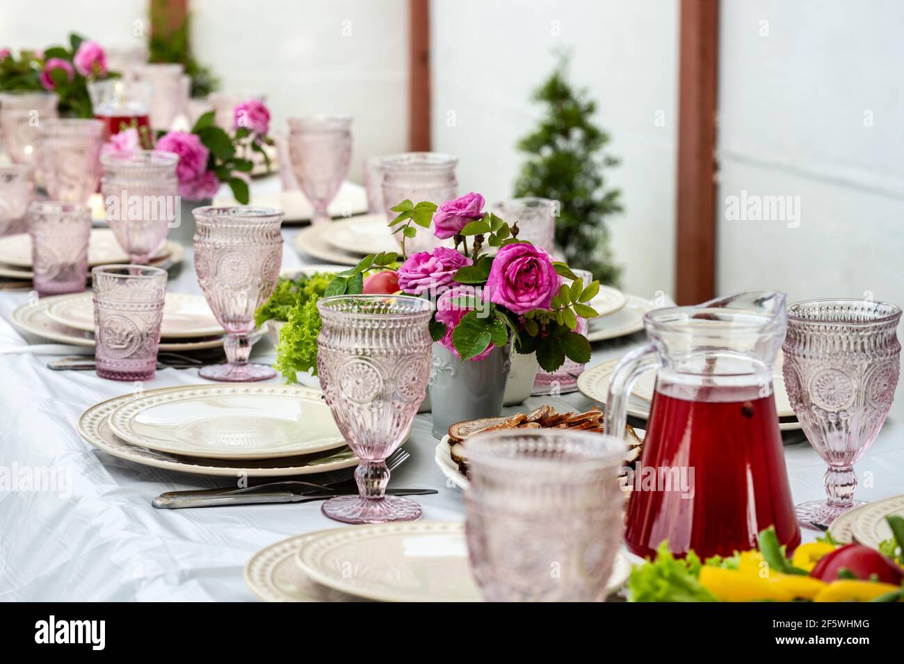 Outdoor dining table setting with cutting vegetables Stock Photo - Alamy