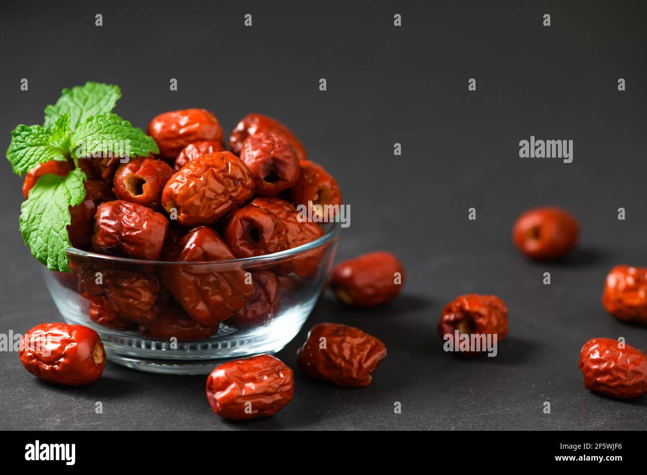 Dried Jujube, Chinese dried red date fruit with Mint leaves in glass ...
