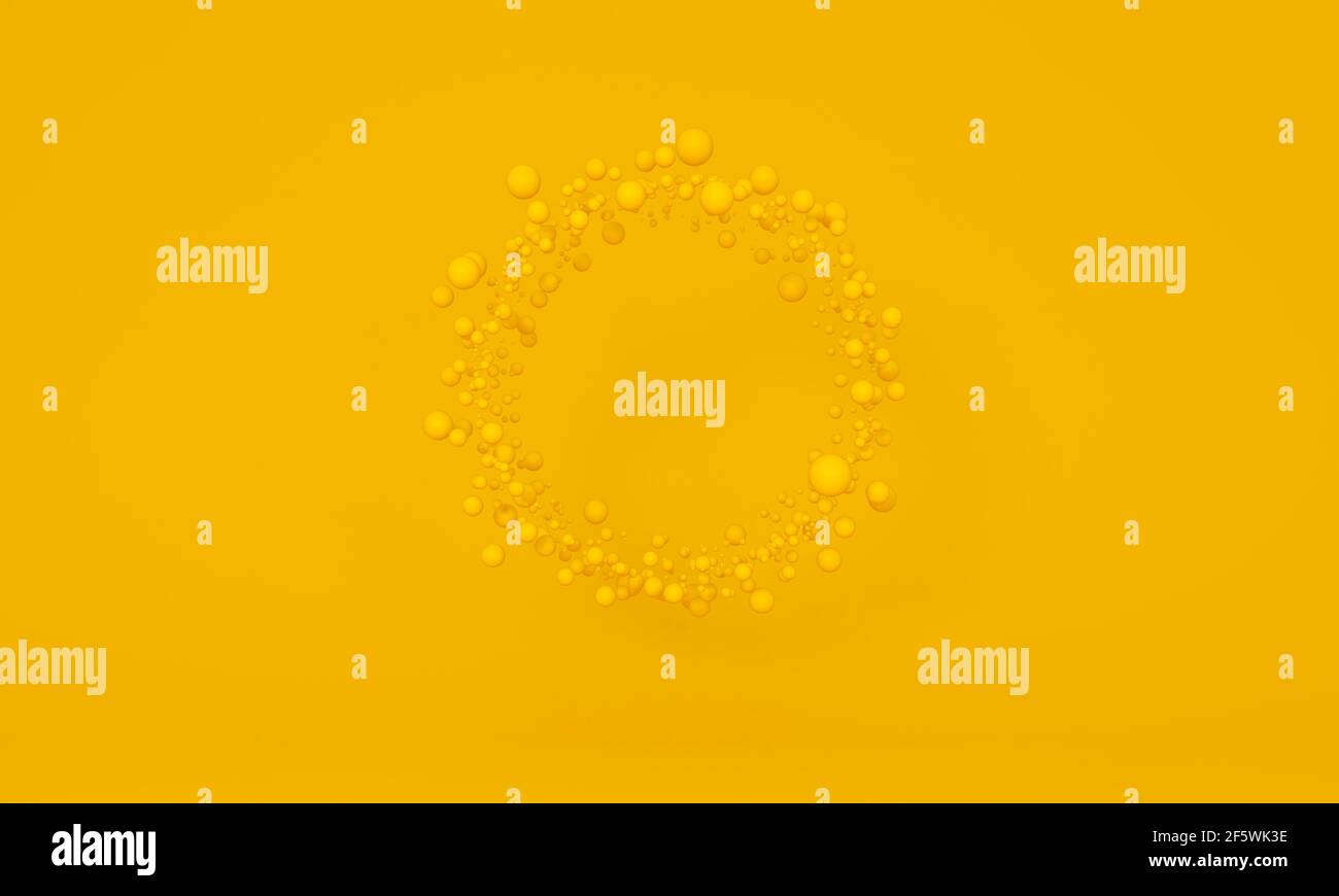 Yellow particles forming a circle floating on studio background ...