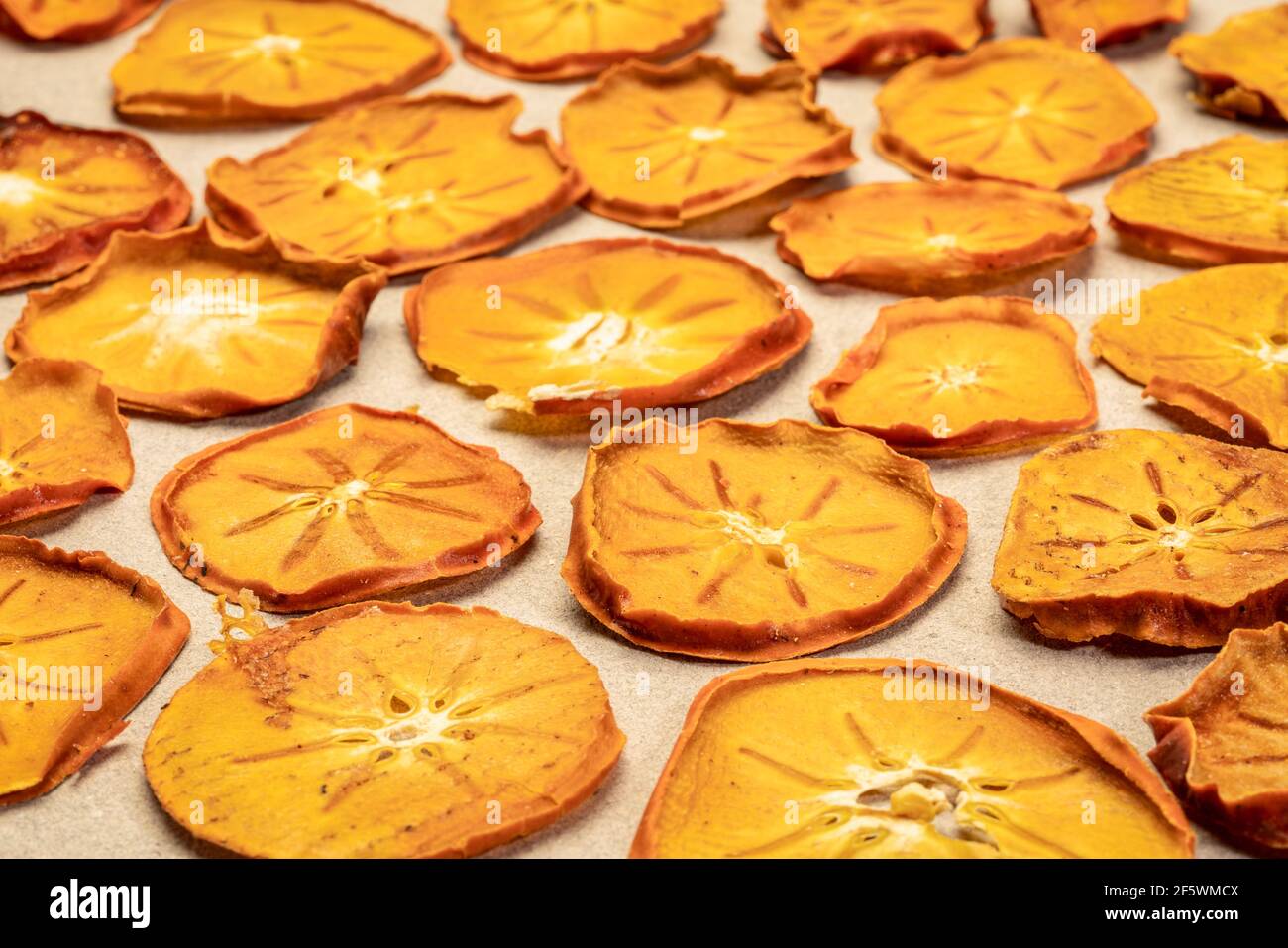 slices of dried persimmon fruit slices - fruit snack Stock Photo - Alamy