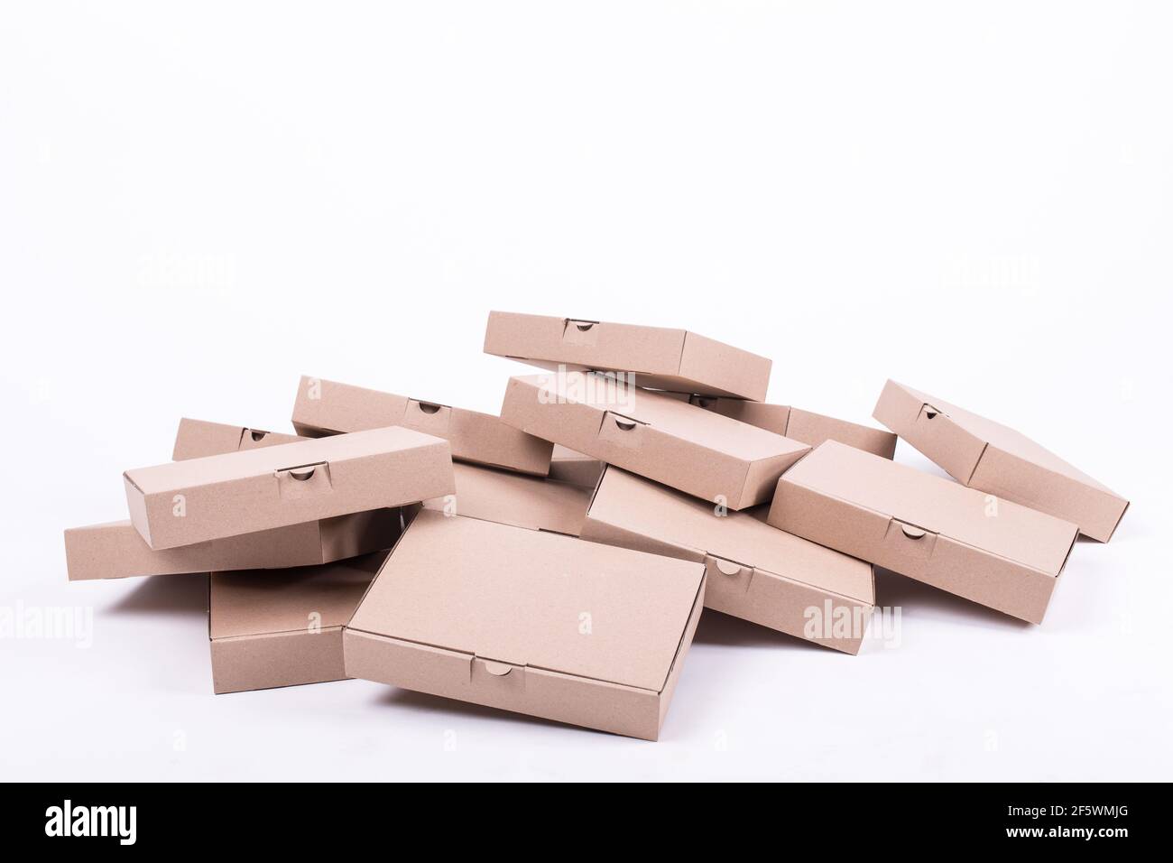 Stack of boxes of the same size isolated on white background, pile of ...