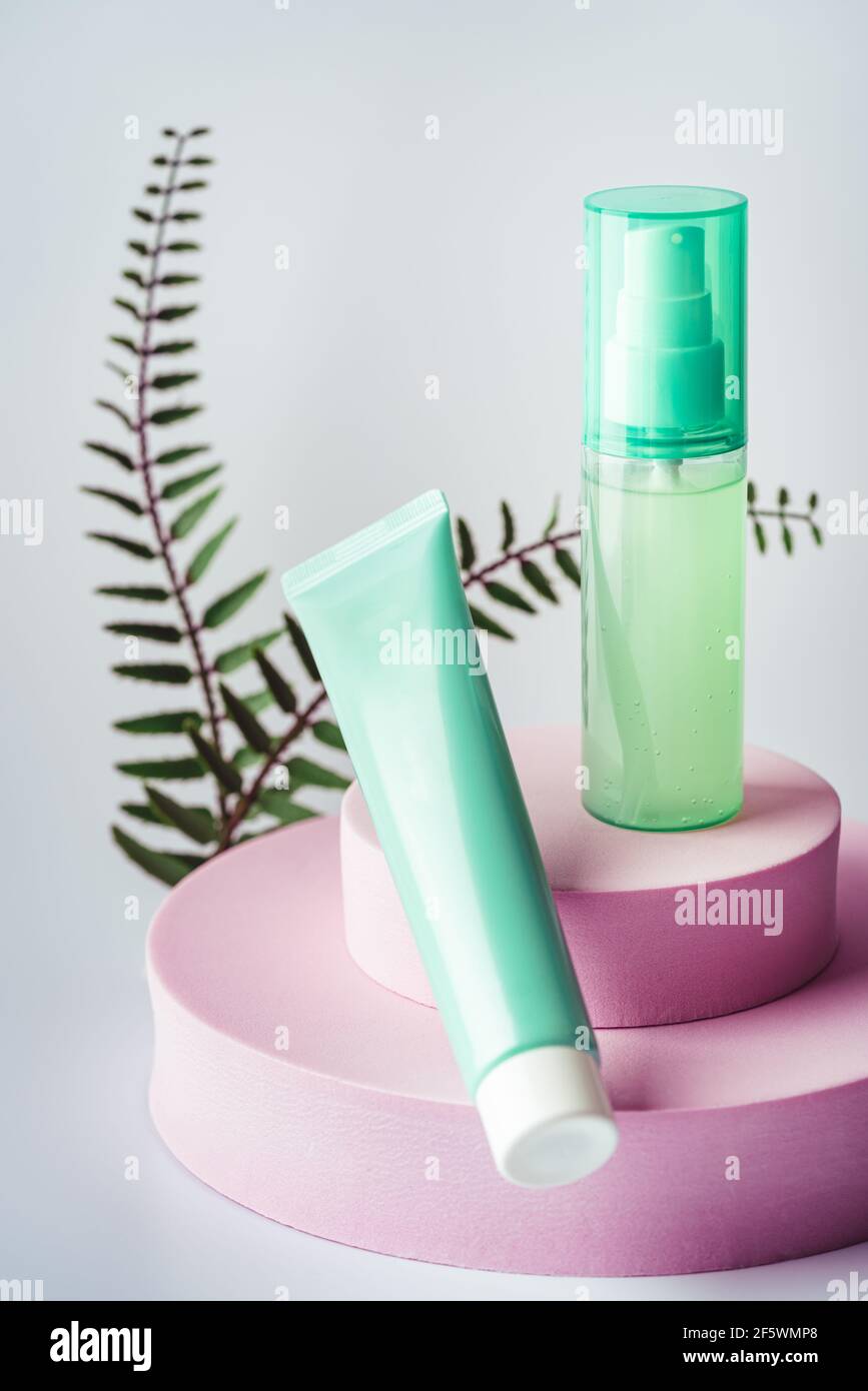 Tube with natural moisturizer face cream on special pink podium ...