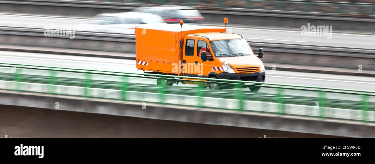 a road maintenance van on an freeway panorama Stock Photo - Alamy