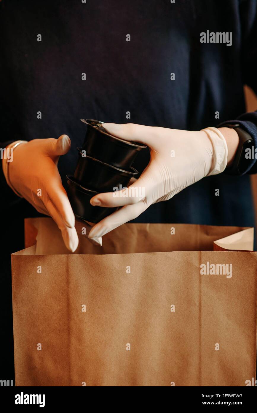 Food delivery worker hi-res stock photography and images - Alamy