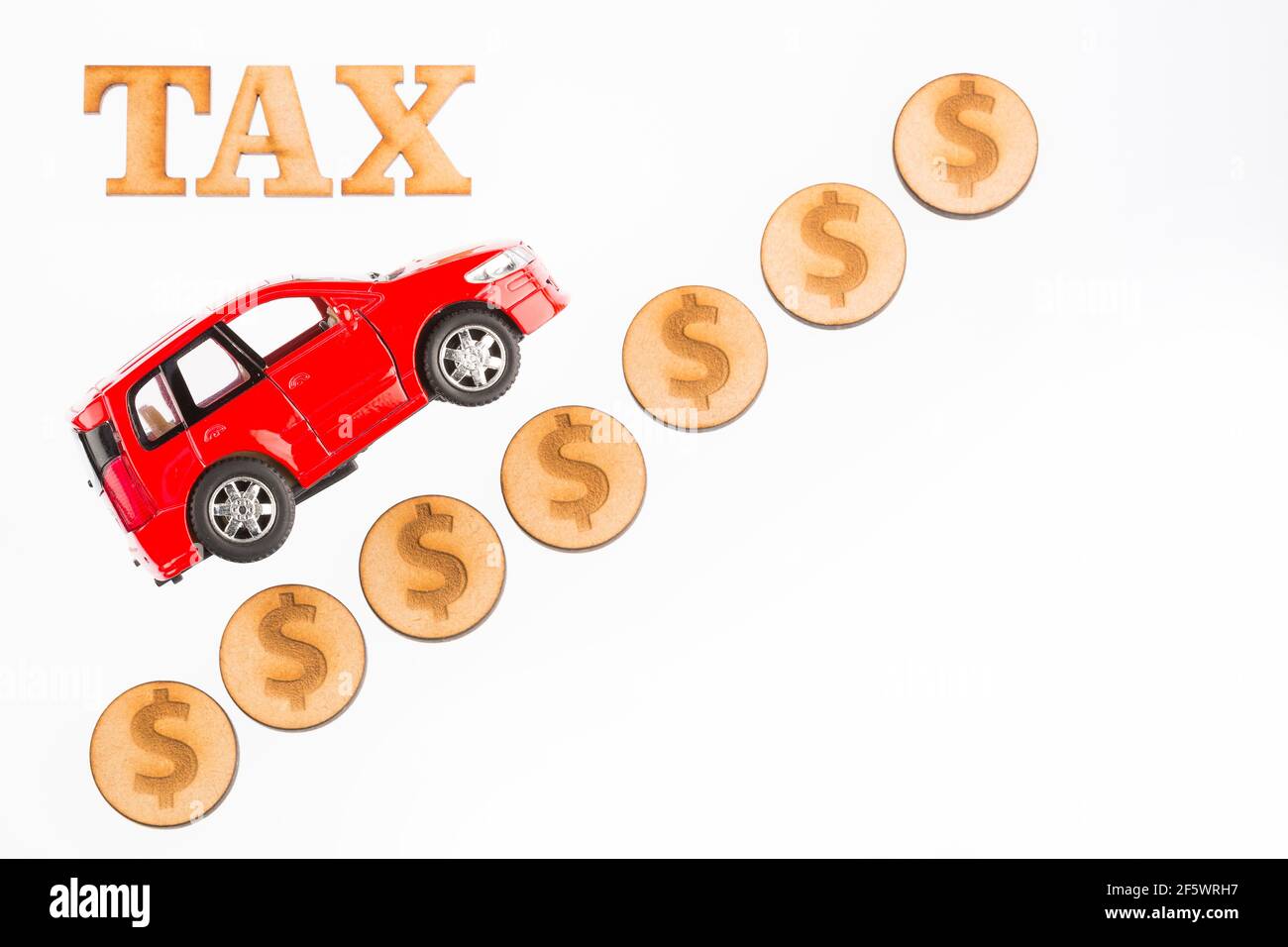 Tax car - car and coins. White background Stock Photo - Alamy