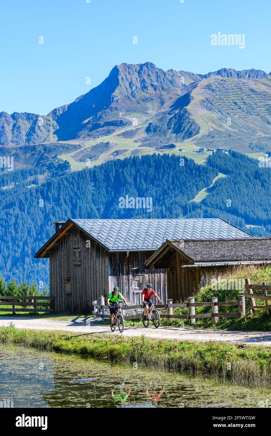 Two friends cycling in beautiful alpine nature Stock Photo - Alamy